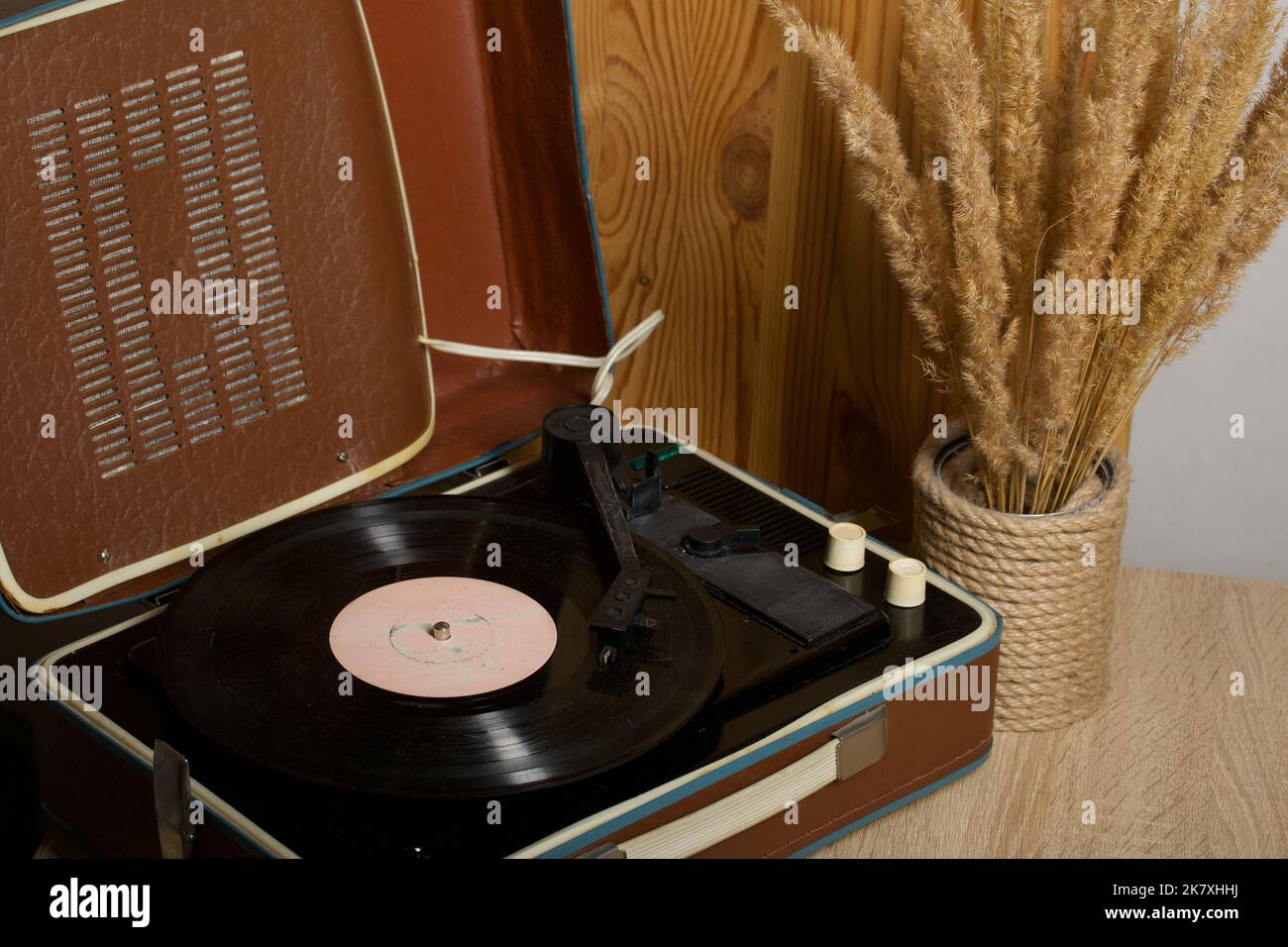 Vintage vinyl record player. The vinyl record is spinning. Close-up ...