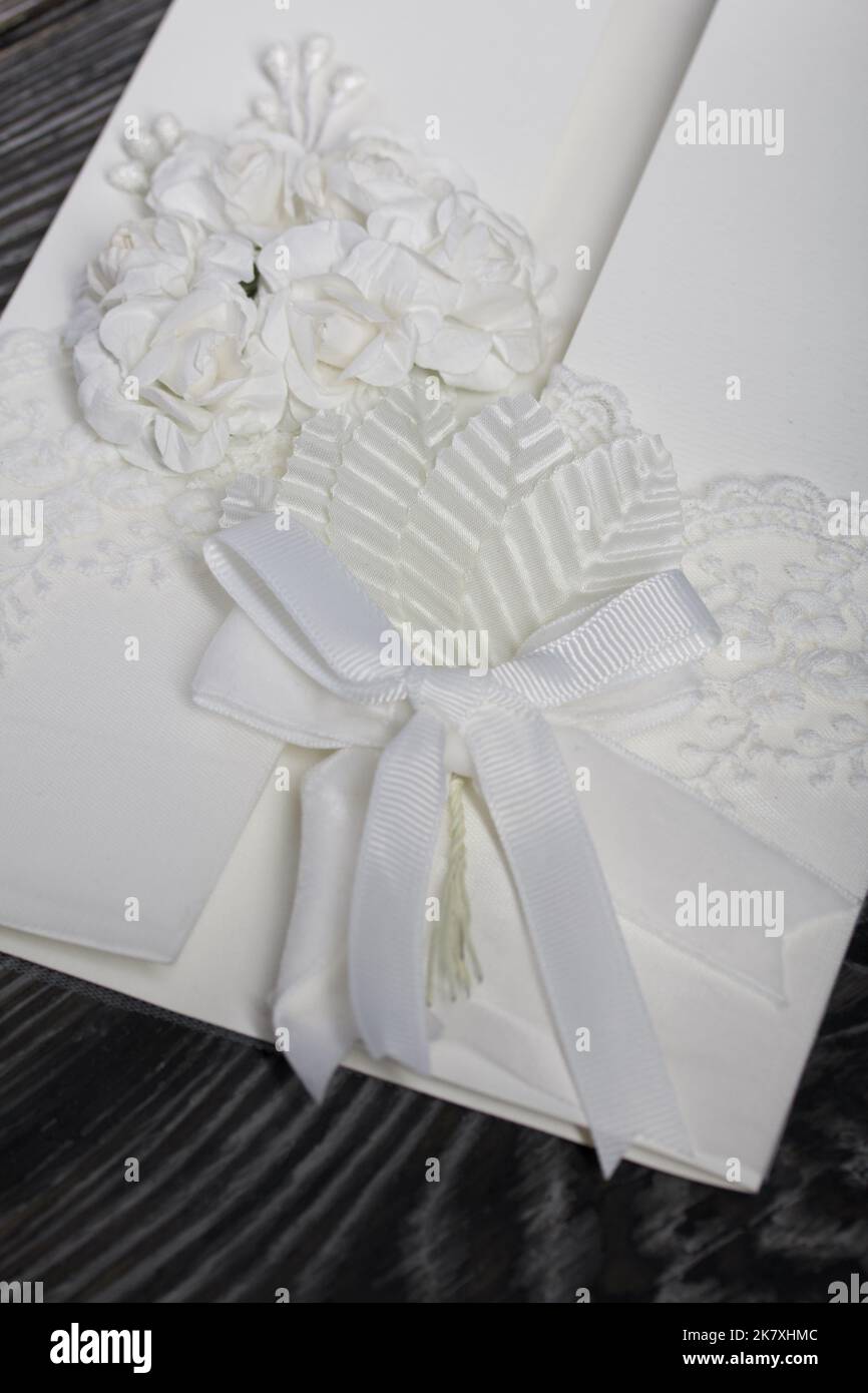 Homemade greeting card in white. With decorative elements. Ribbons ...