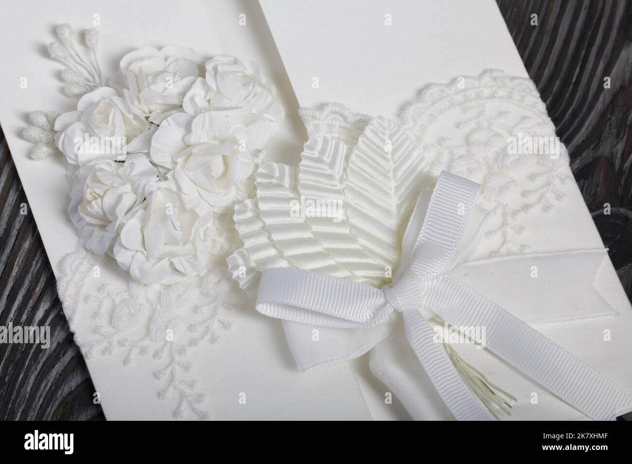 Homemade greeting card in white. With decorative elements. Ribbons ...