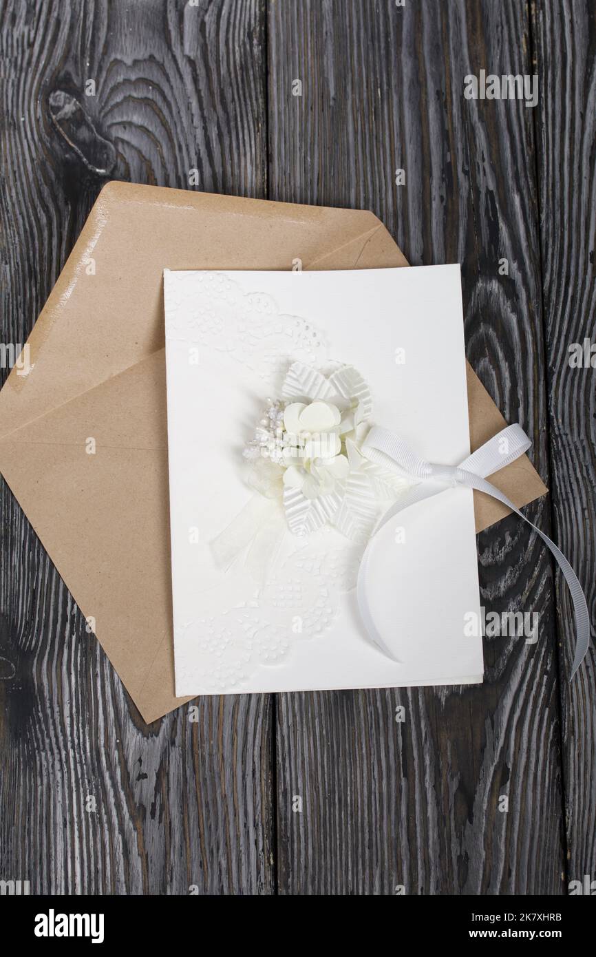 Homemade greeting card in white. With decorative elements. Ribbons ...