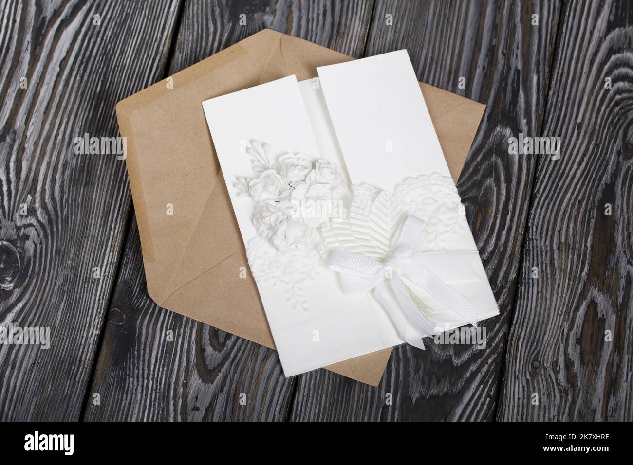Homemade greeting card in white. With decorative elements. Ribbons ...
