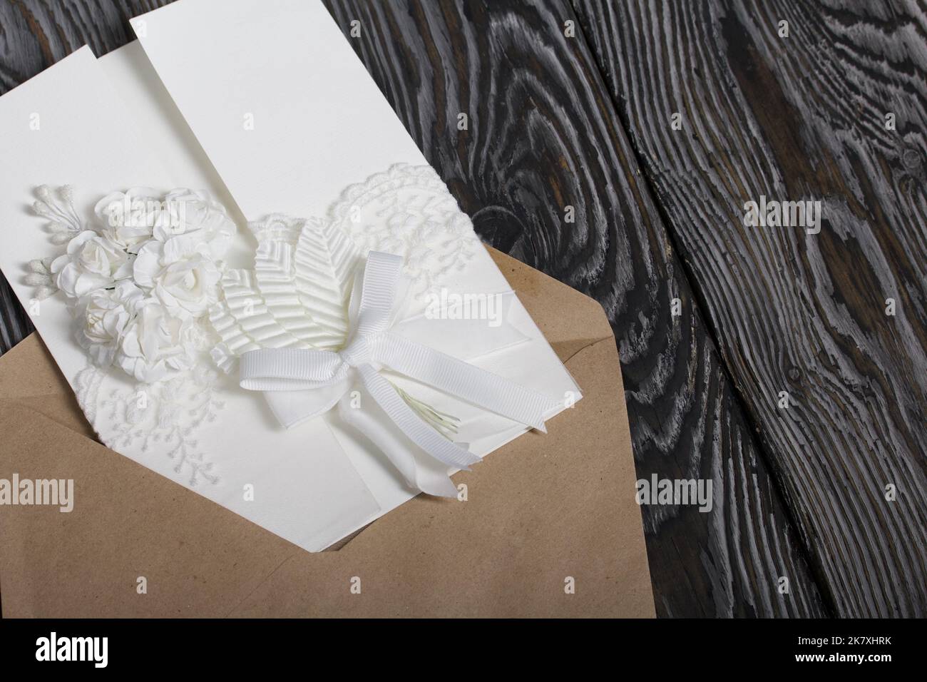 Homemade greeting card in white. With decorative elements. Ribbons ...