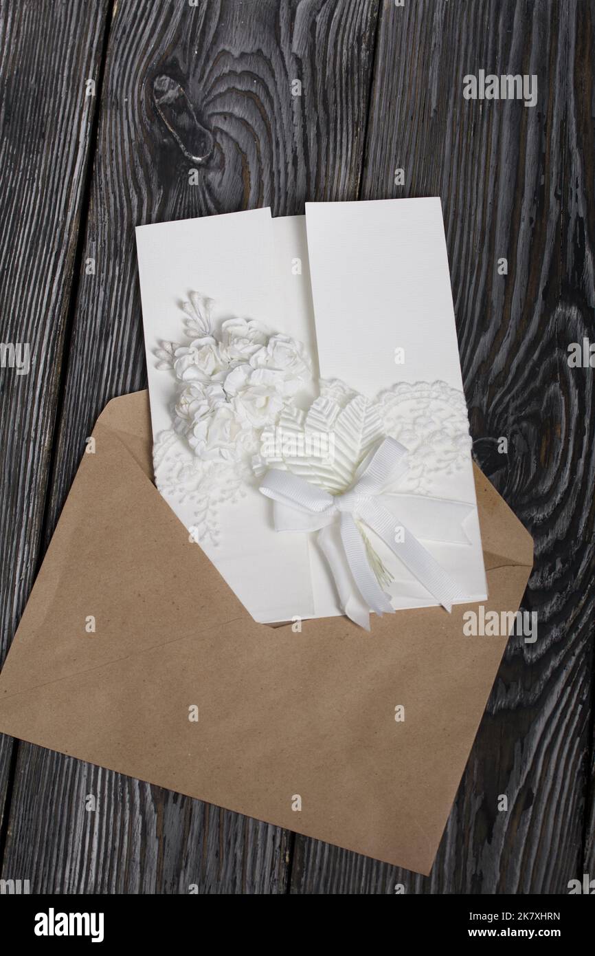 Homemade greeting card in white. With decorative elements. Ribbons ...