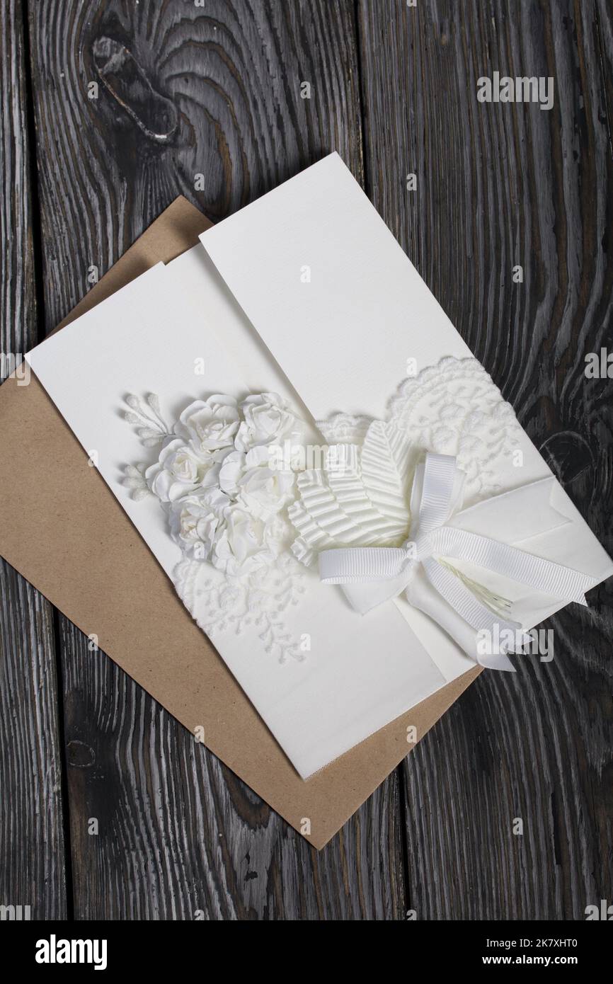 Homemade greeting card in white. With decorative elements. Ribbons ...