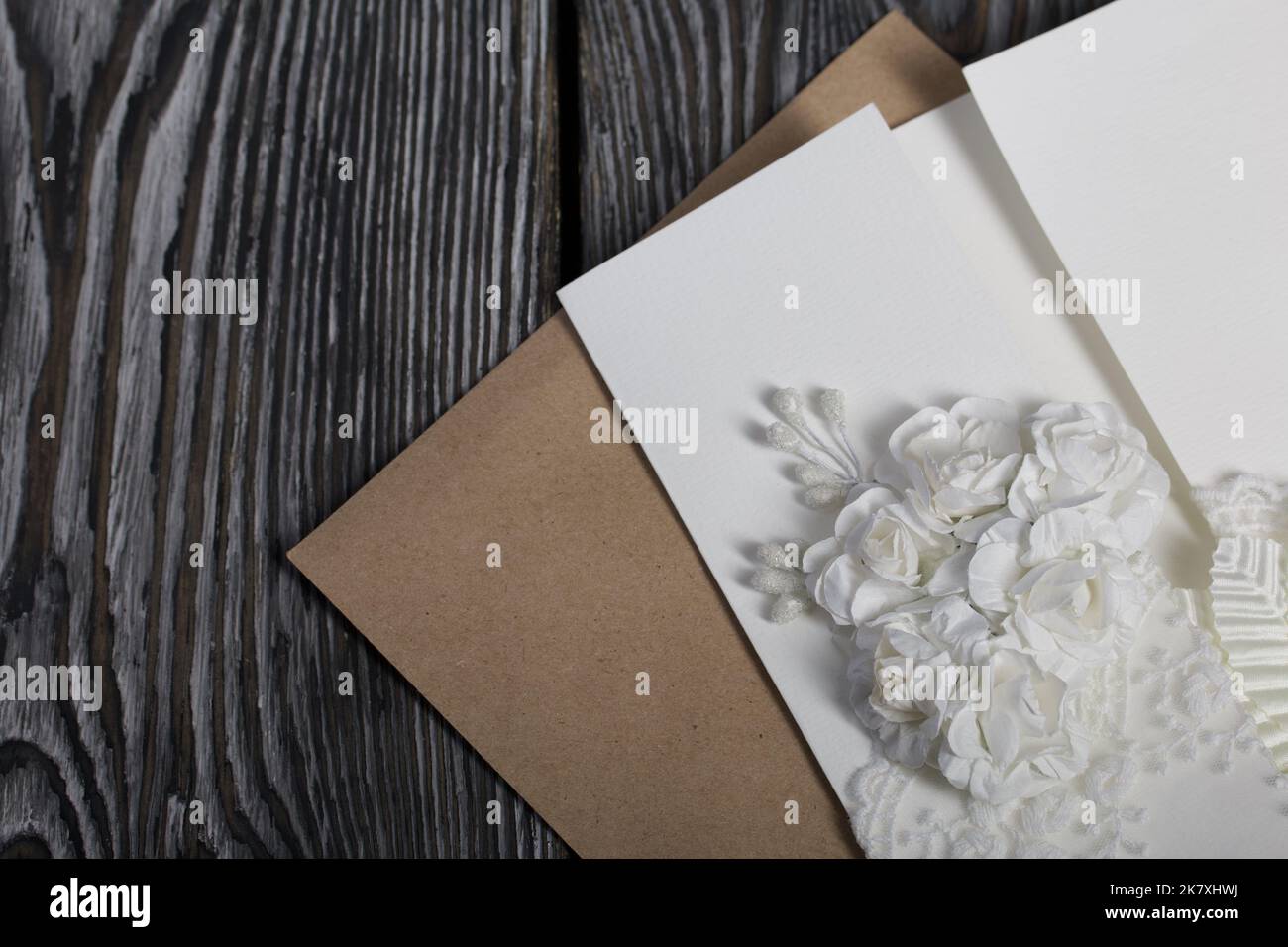 Homemade greeting card in white. With decorative elements. Ribbons ...