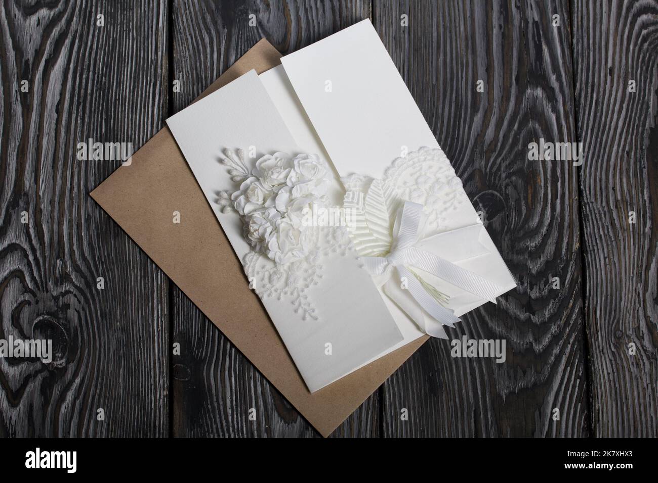Homemade greeting card in white. With decorative elements. Ribbons ...