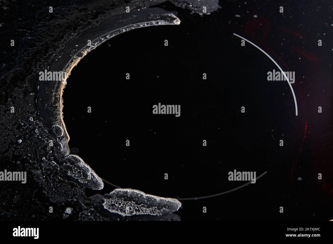 Ceramic kitchen stove burn damage marks and dry saline water splashes ...