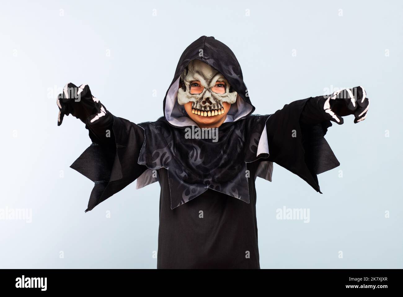 Portrait of an angry boy in halloween costume with frightening gesture ...