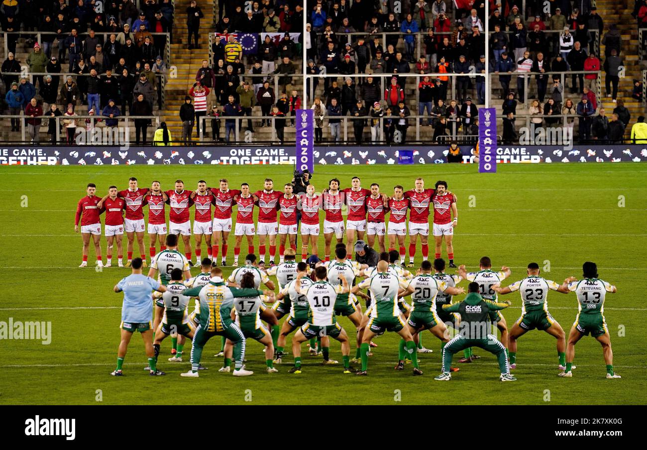 Wales players watch as Cook Islands' players perform the Haka, before ...