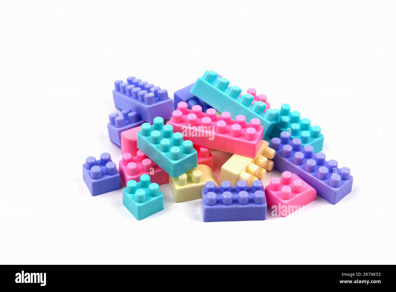 Pastel colored toy blocks on white background Stock Photo - Alamy