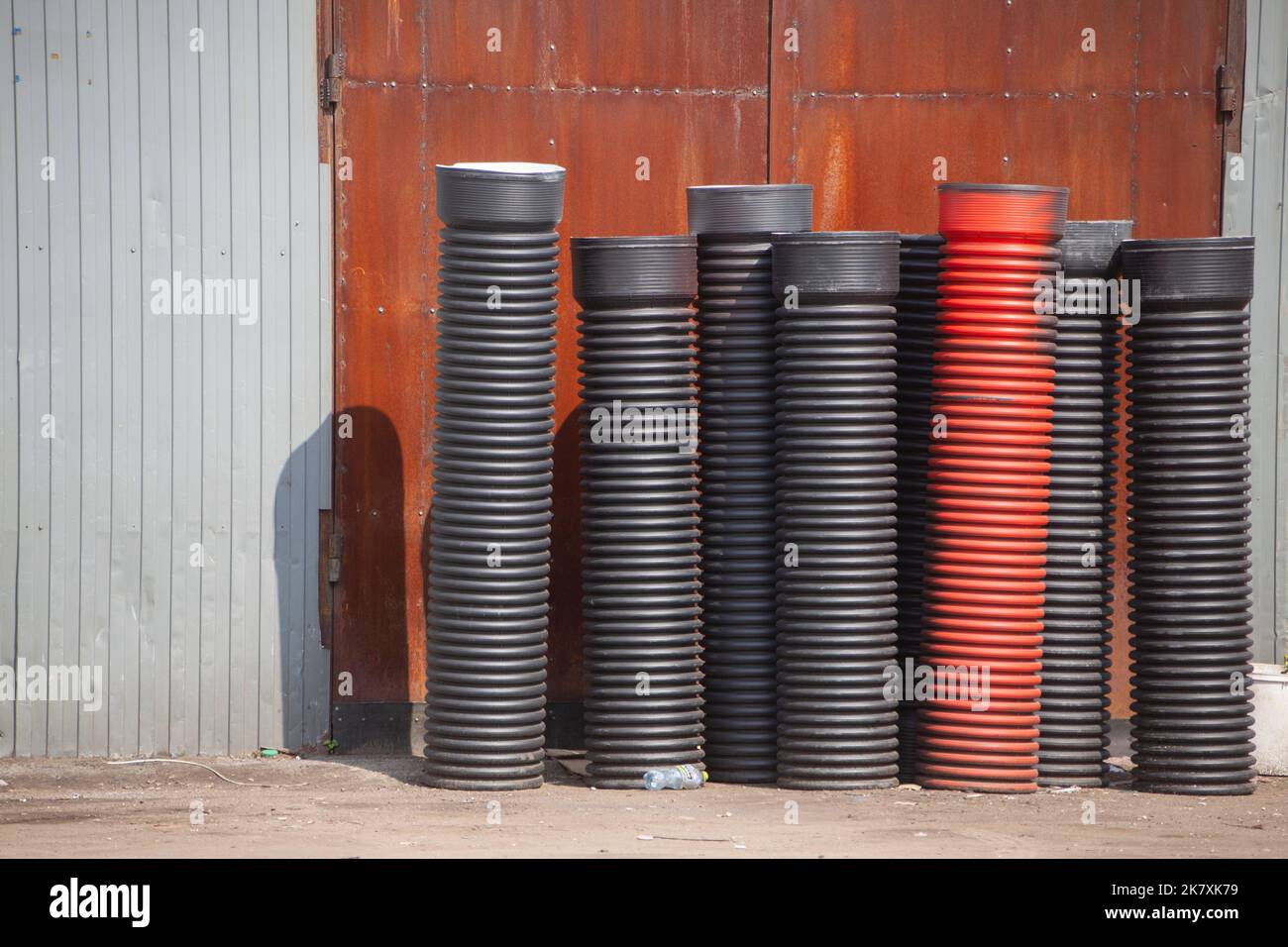 Plastic pipes for sewerage on street. Ribbed pipes in stock. Sewerage ...