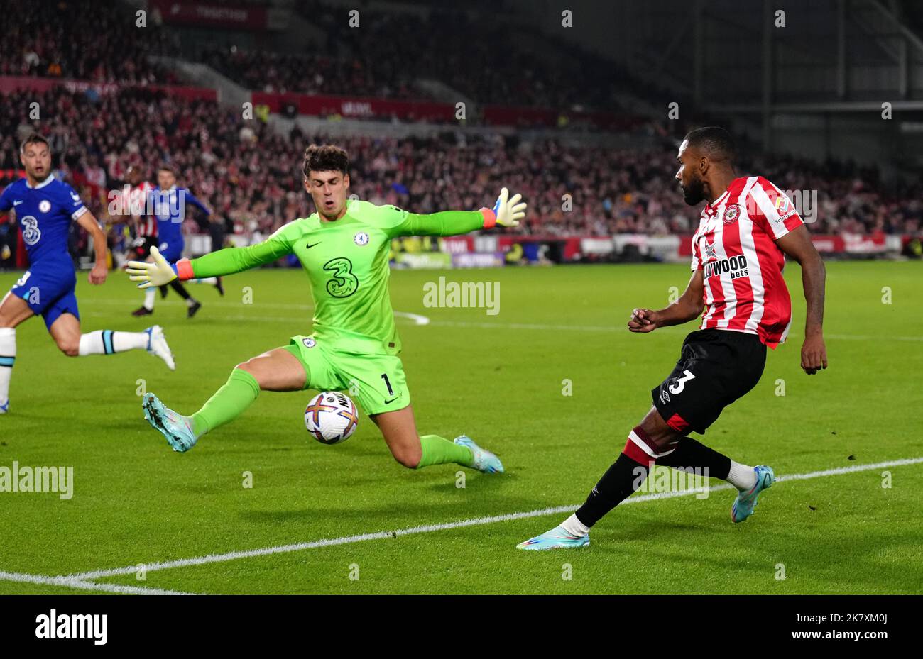 Brentford's Rico Henry tries to beat Chelsea goalkeeper Kepa ...