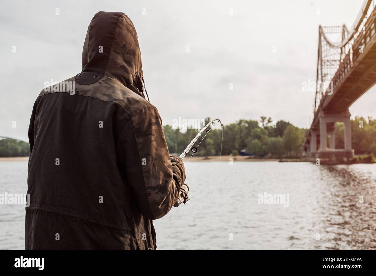 Back view young fisherman spinning hi-res stock photography and images ...