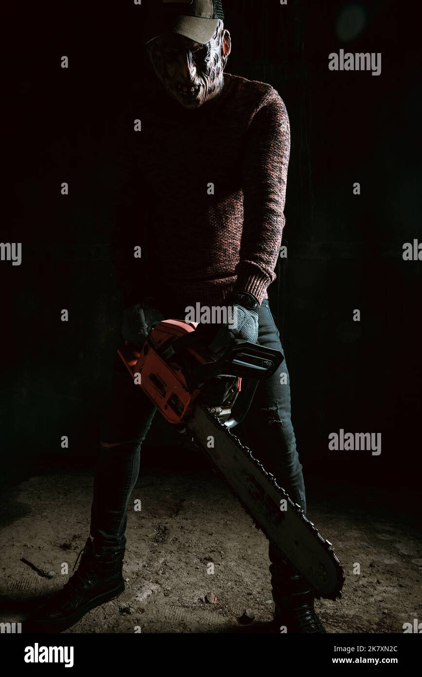 Horror character wearing mas and holding chainsaw, Halloween scary ...