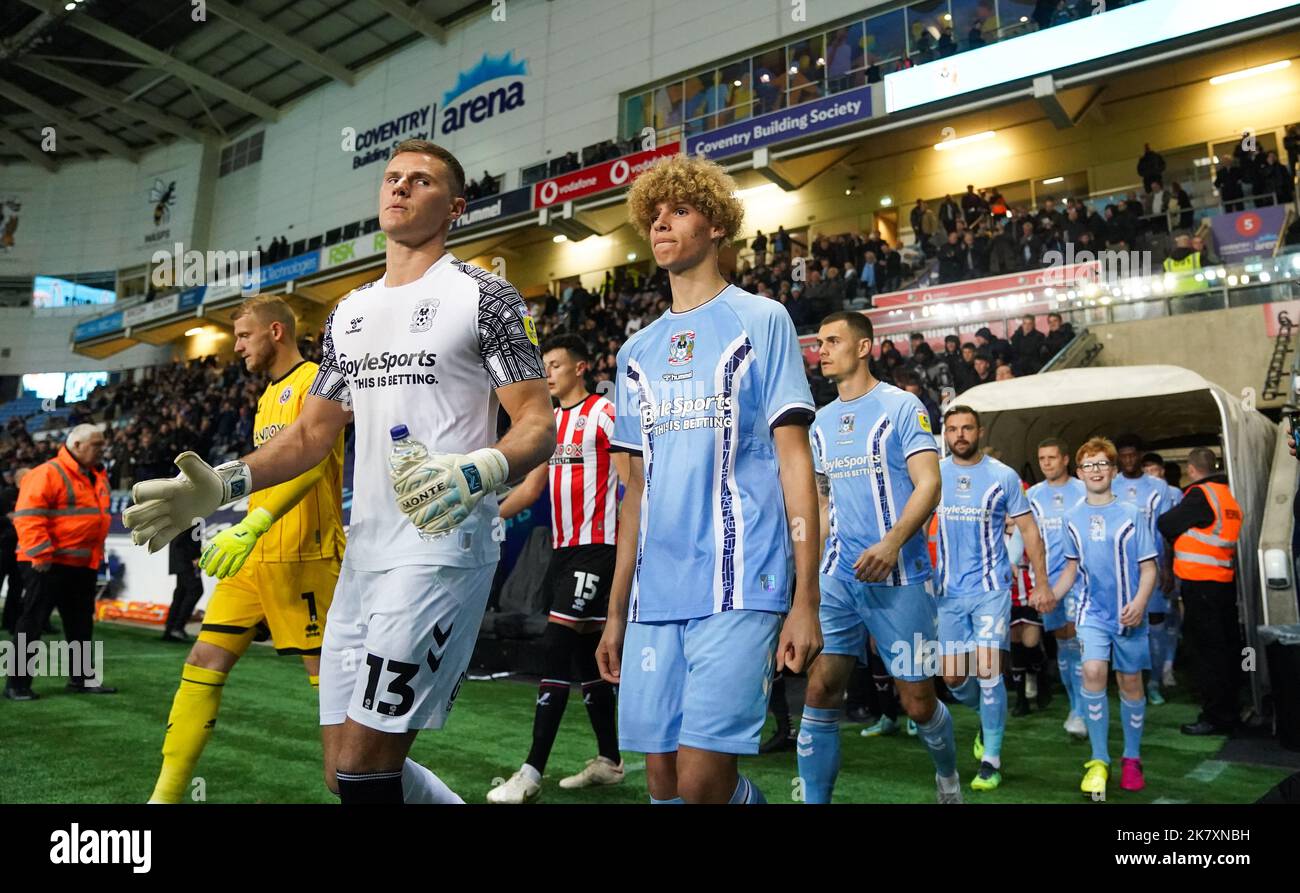 Coventry City Goalkeeper Ben Wilson Walks Out With A Mascot Ahead Of