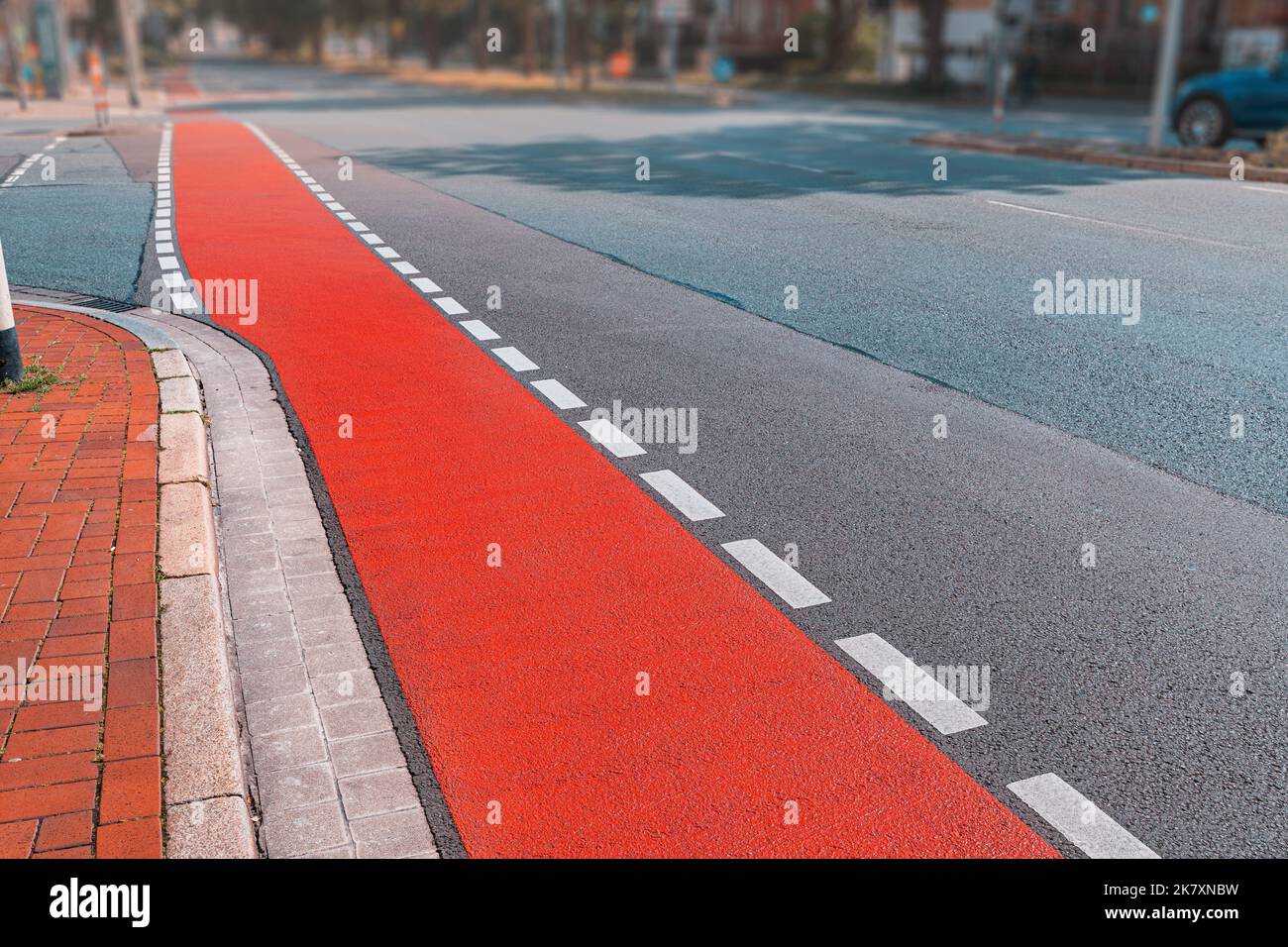 Painted in red bike path on the streets of the city. Alternative ...