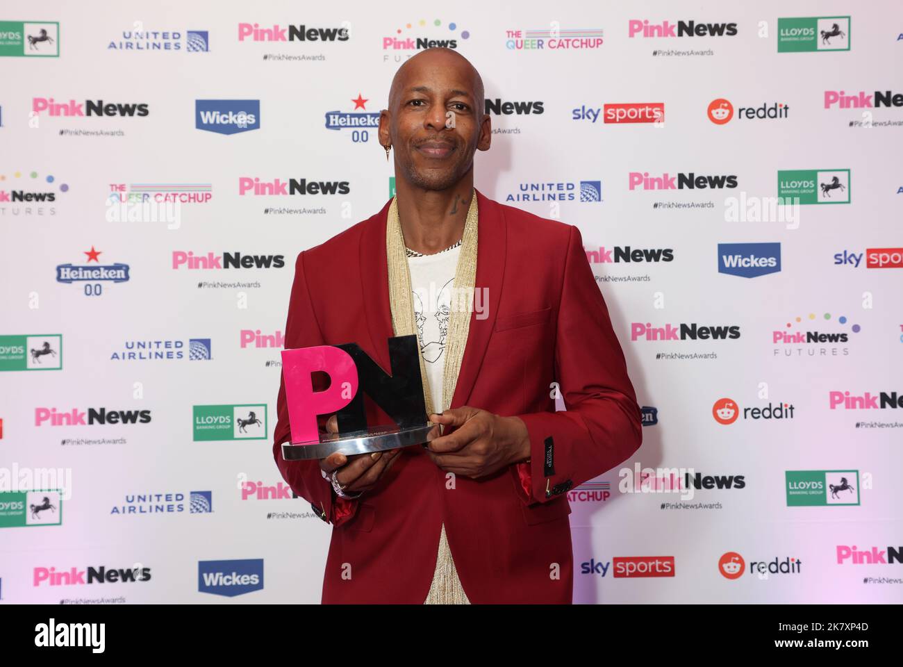 Topher Campbell with his PinkNews Broadcasting Award during the ...