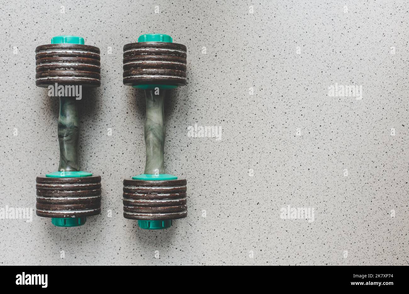 Vintage dumbbells, top view. Sport background Stock Photo - Alamy