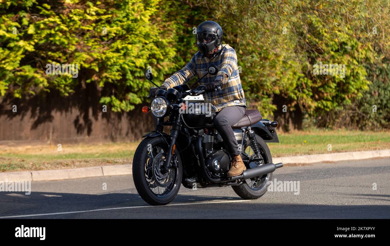 Man riding a 2022 1200 cc Triumph Bonneville T120 Black motorcycle ...