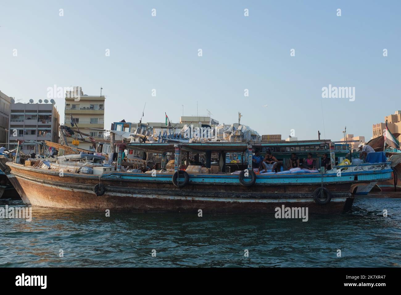 Old and traditional cargo ship, called a Dhow, moored at Dubai Creek ...