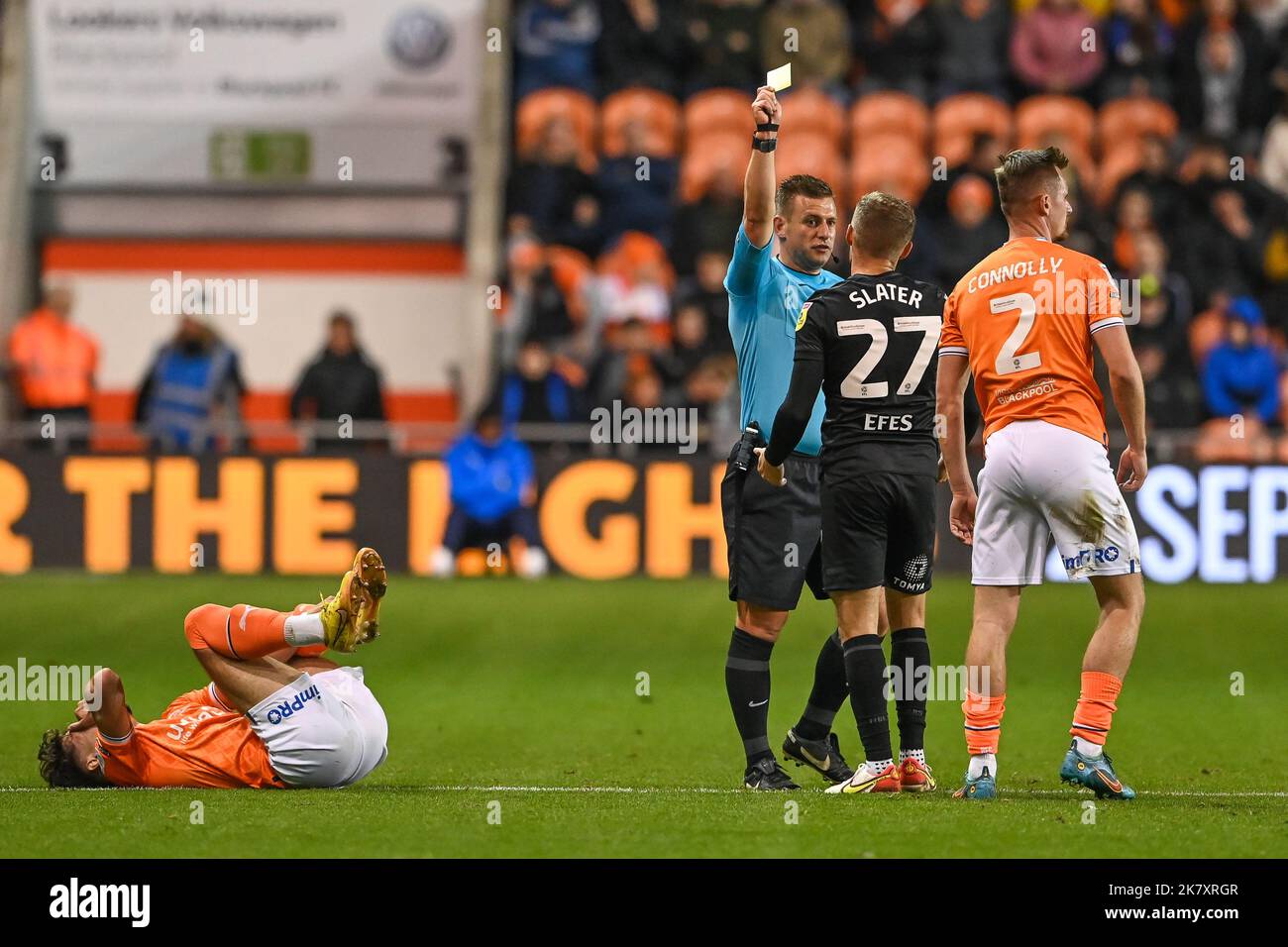 Referee Josh Smith gives a yellow card to Regan Slater #27 of Hull City ...