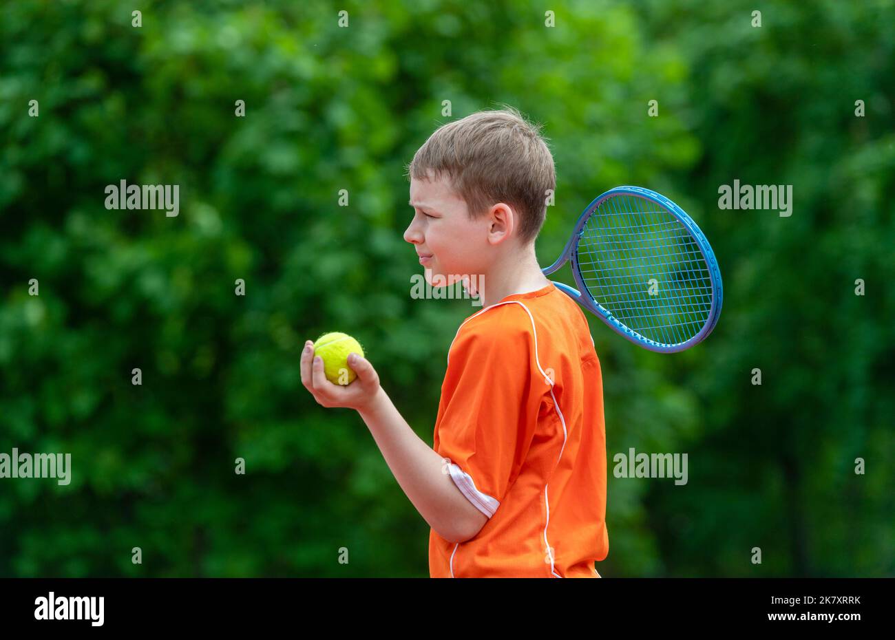 Child with tennis racket on tennis court. Training for young kid ...