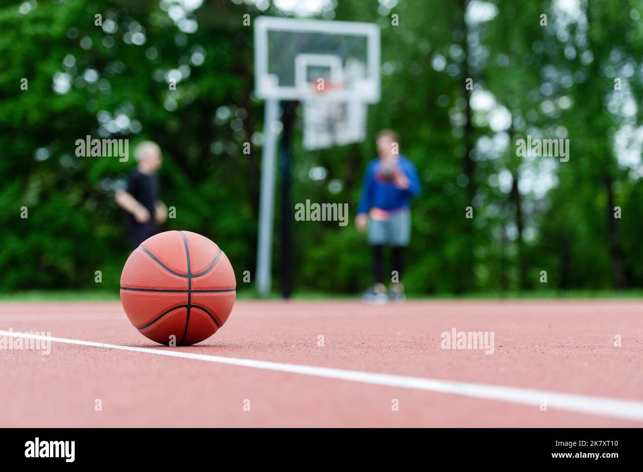 Orange basketball on brown court of gymnasium sport floor. Street ...