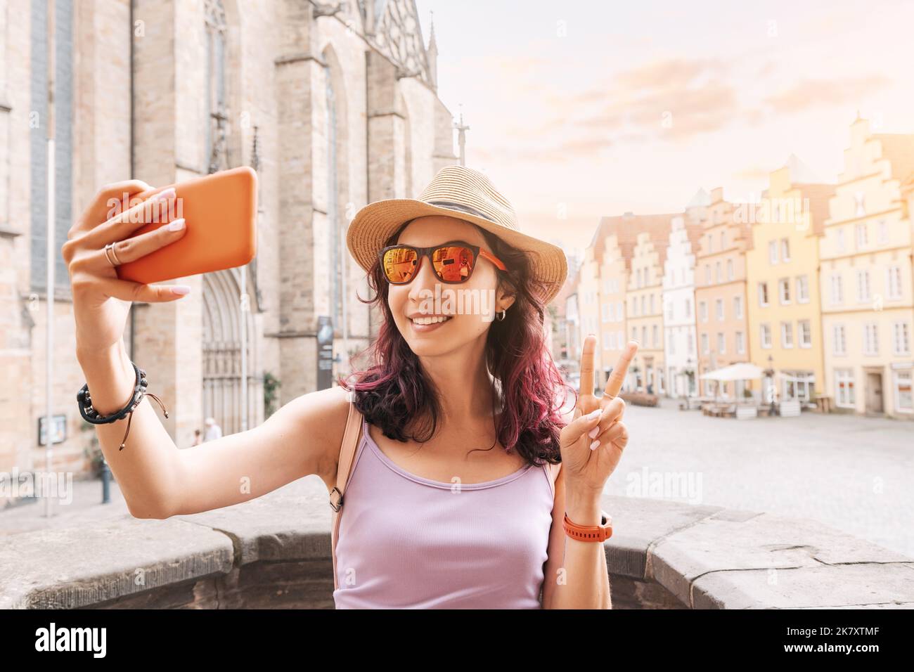 Travel blogger takes selfie photos on the camera of smartphone of the ...