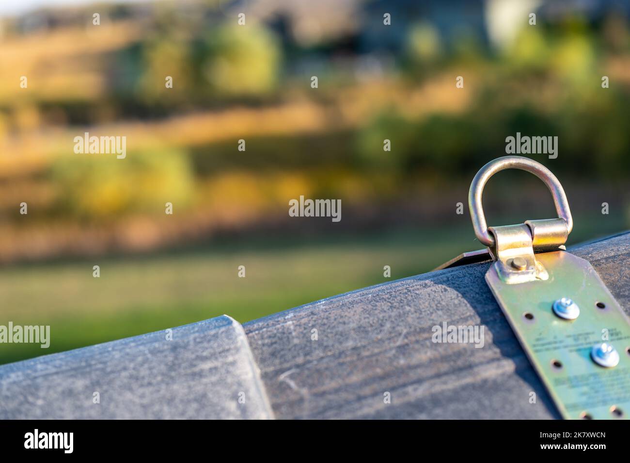 Selective focus on a metal temporary anchor installed on the peak of a ...