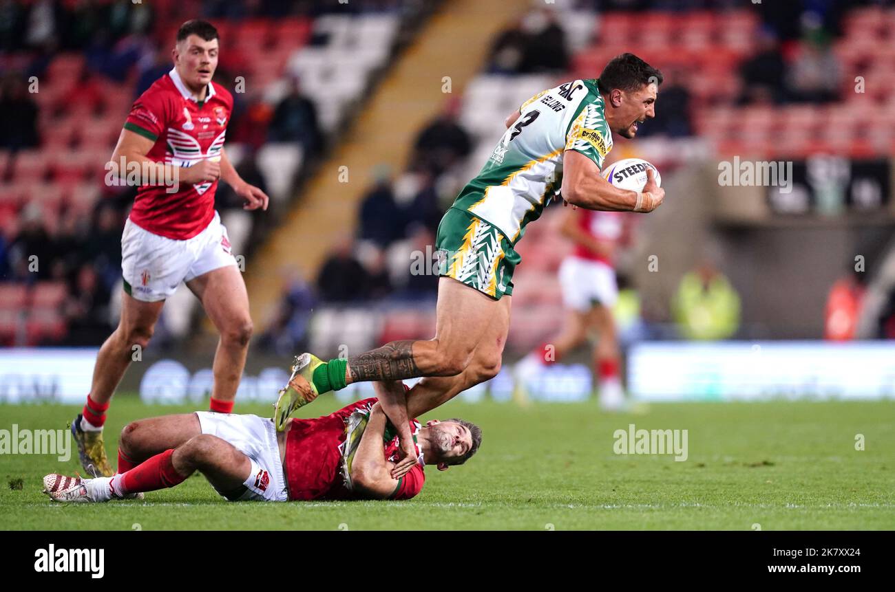Wales' Elliot Kear tackles Cook Islands' Anthony Gelling during the ...