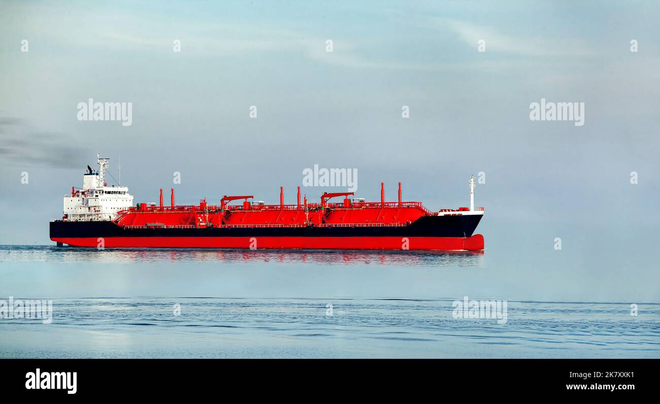 Long oil and gas petrochemical tanker offshore in opensea with 3 red ...