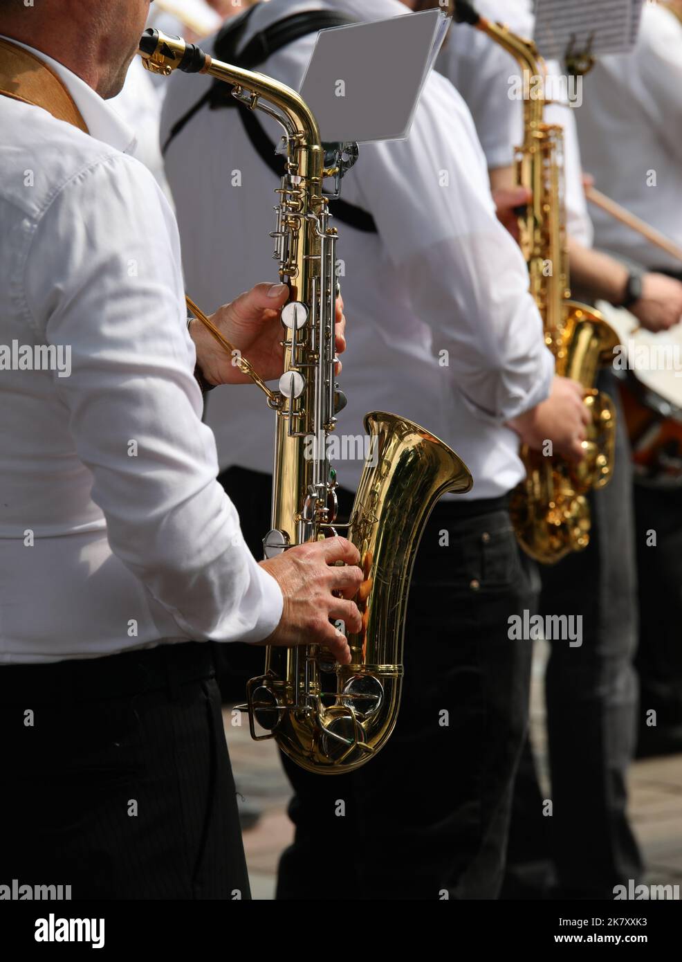 saxophonists of the musical band during the singing event in the town ...