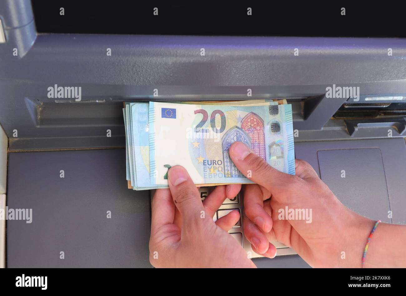 hand with money Euro banknotes withdrawn from the ATM of an European ...