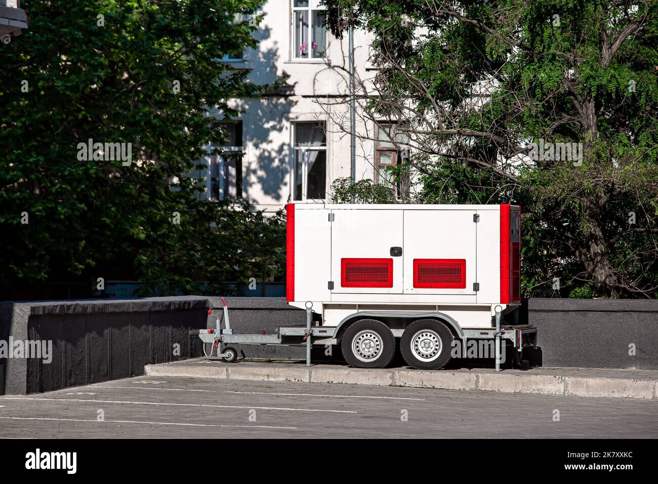 White and red Backup Generator on the trailer with wheels. Mobile ...