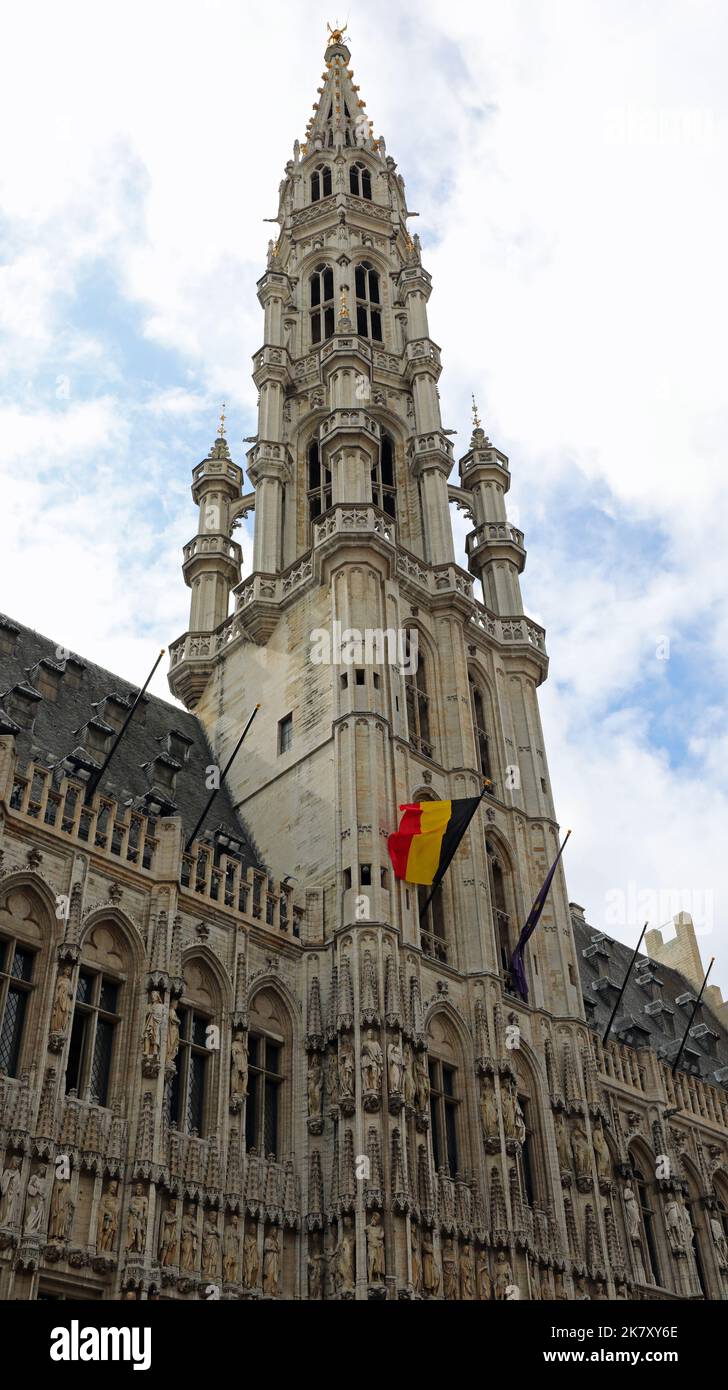 Brussels town hall and belgian flag in Grand Place the main square of ...