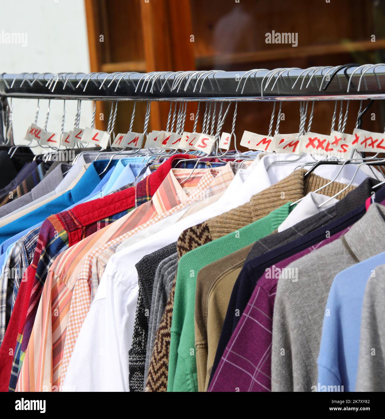 vintage used clothes and new dresses in the stall at market Stock Photo ...