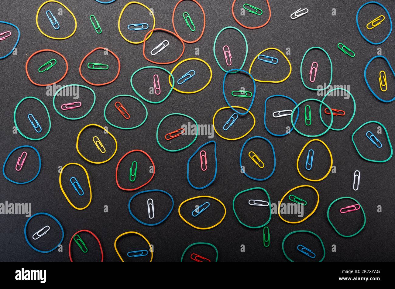 Texture and background of paper clips and rubber bands. Lots of circles ...