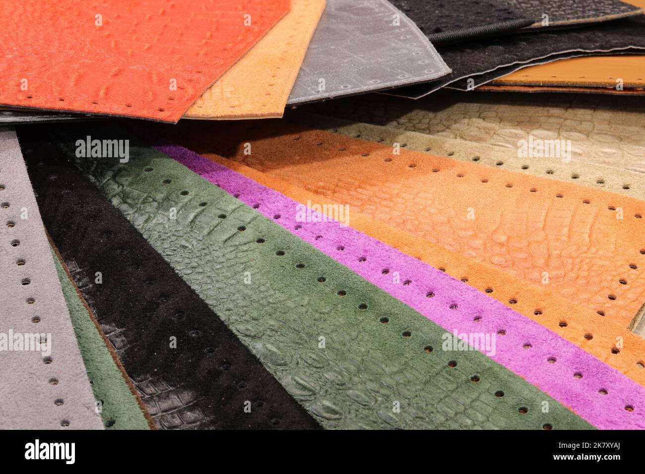 cut pieces of worked and colored leather for the creation of fashion ...