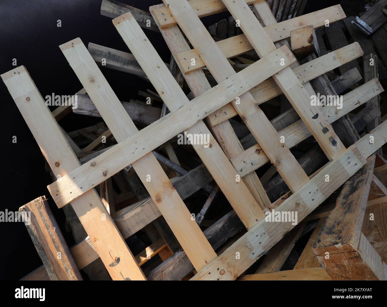 used broken wooden pallets inside the recycling container of used ...