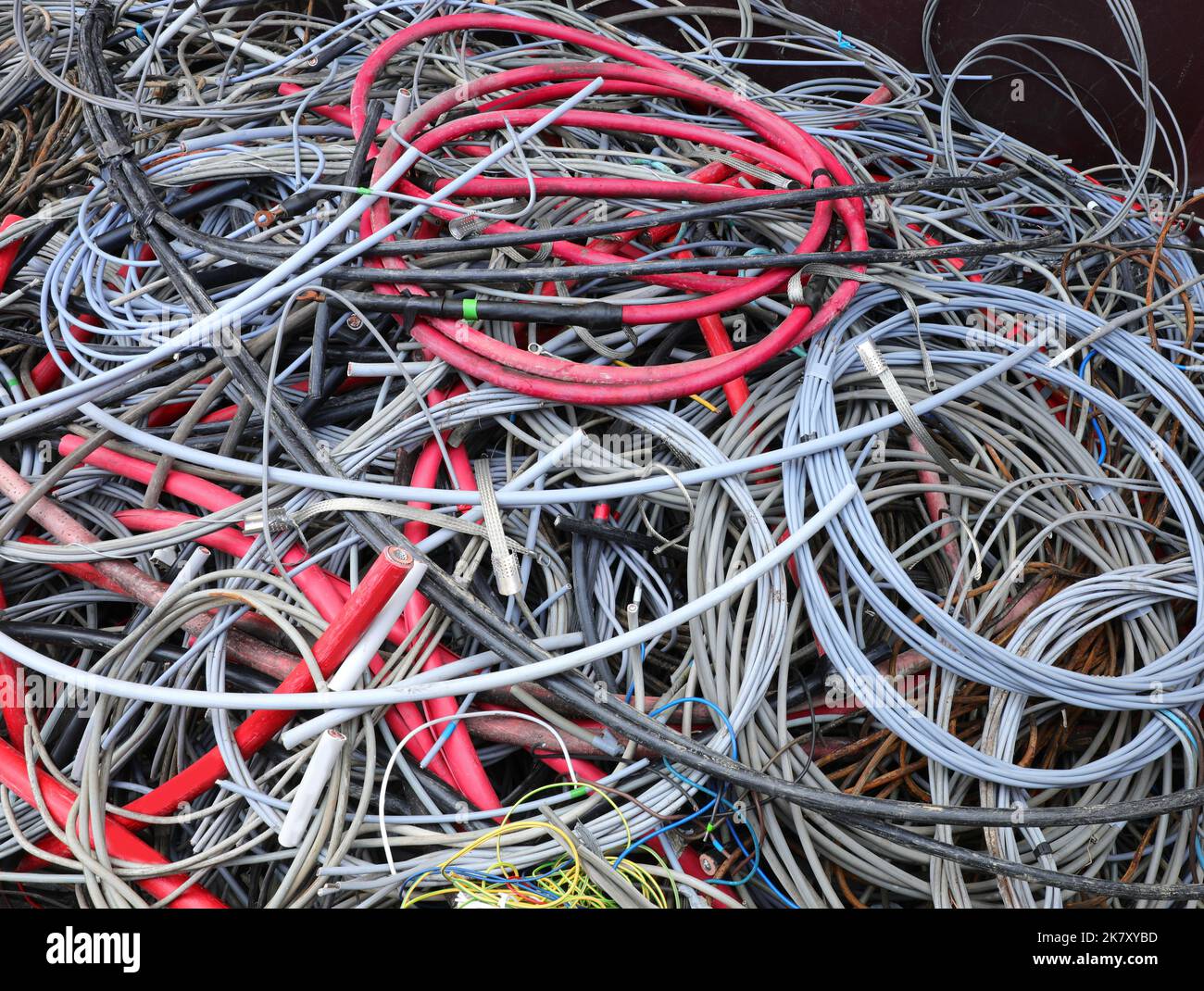 tangles of old used electrical cables in the landfill to be recycled ...