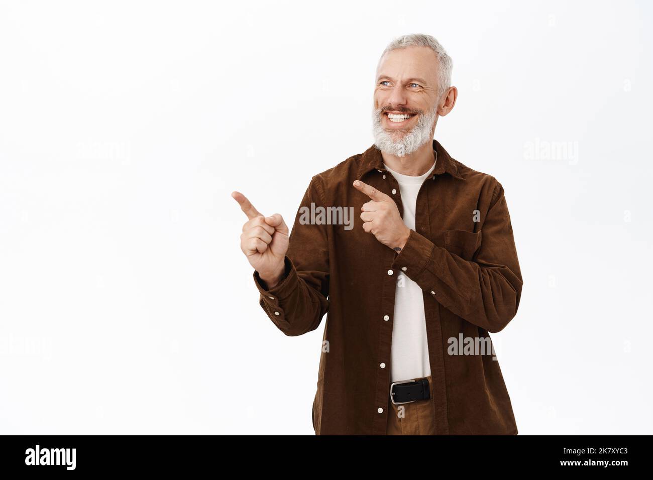 Enthusiastic old man, senior mature person pointing fingers left ...