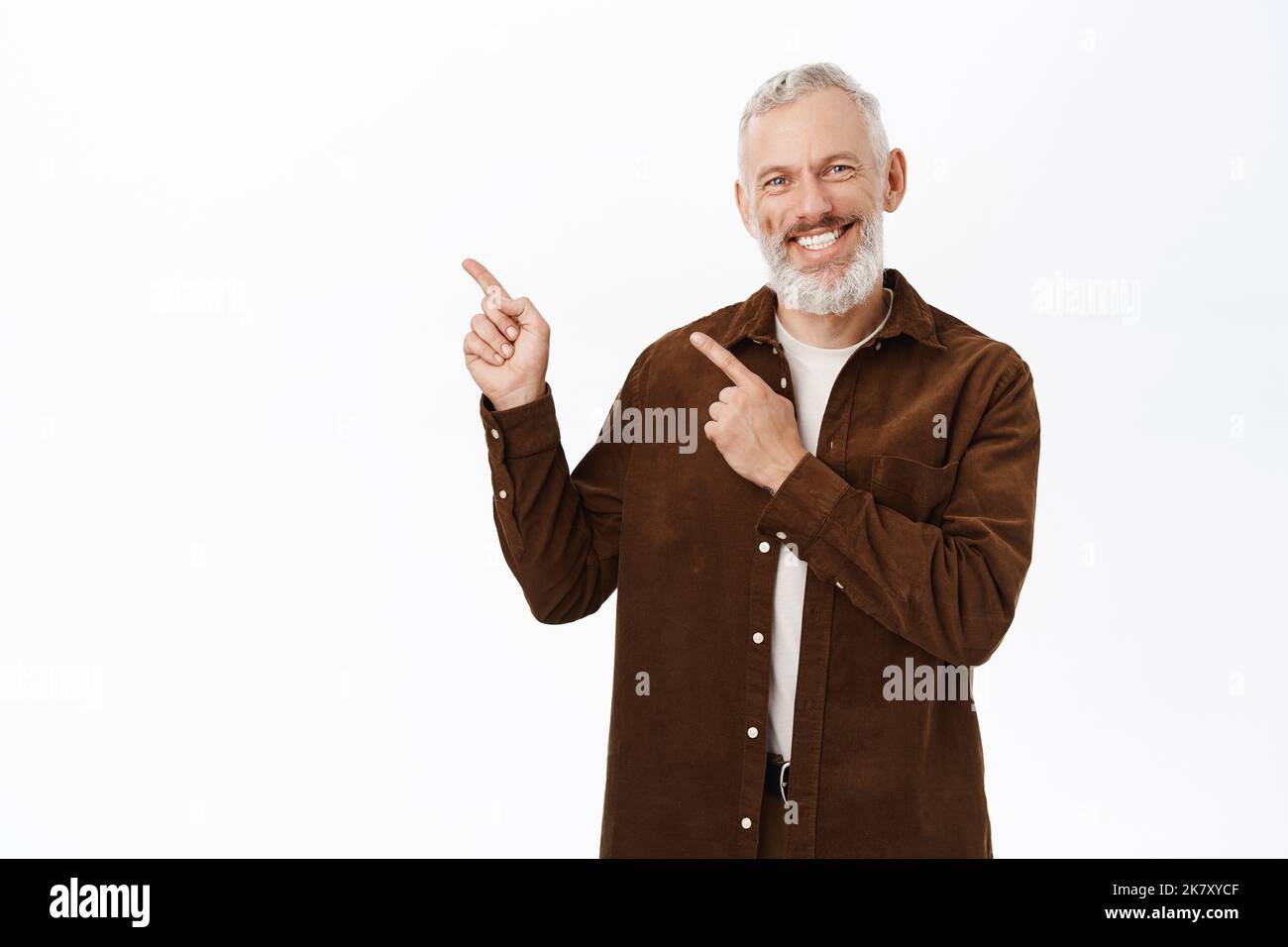 Enthusiastic old man, senior mature person pointing fingers left ...