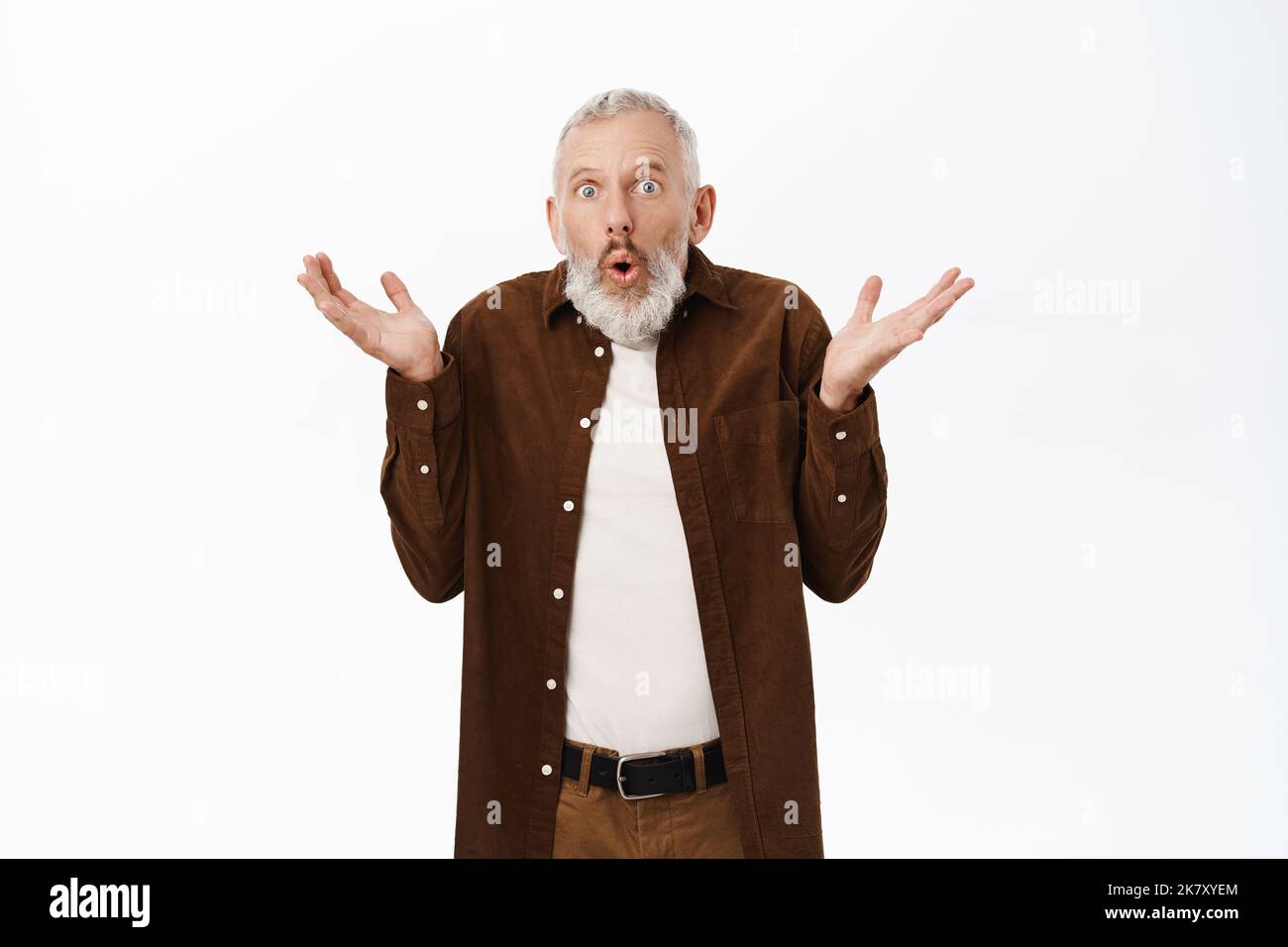 Confused old guy shrugging shoulders, looking clueless, standing over ...