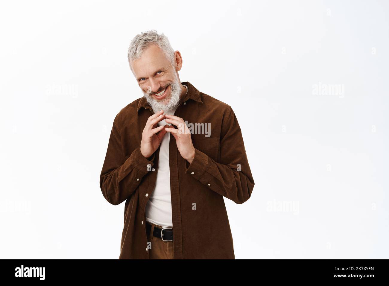 Greedy old man scheming. Senior guy with white hair and beard, steeple ...