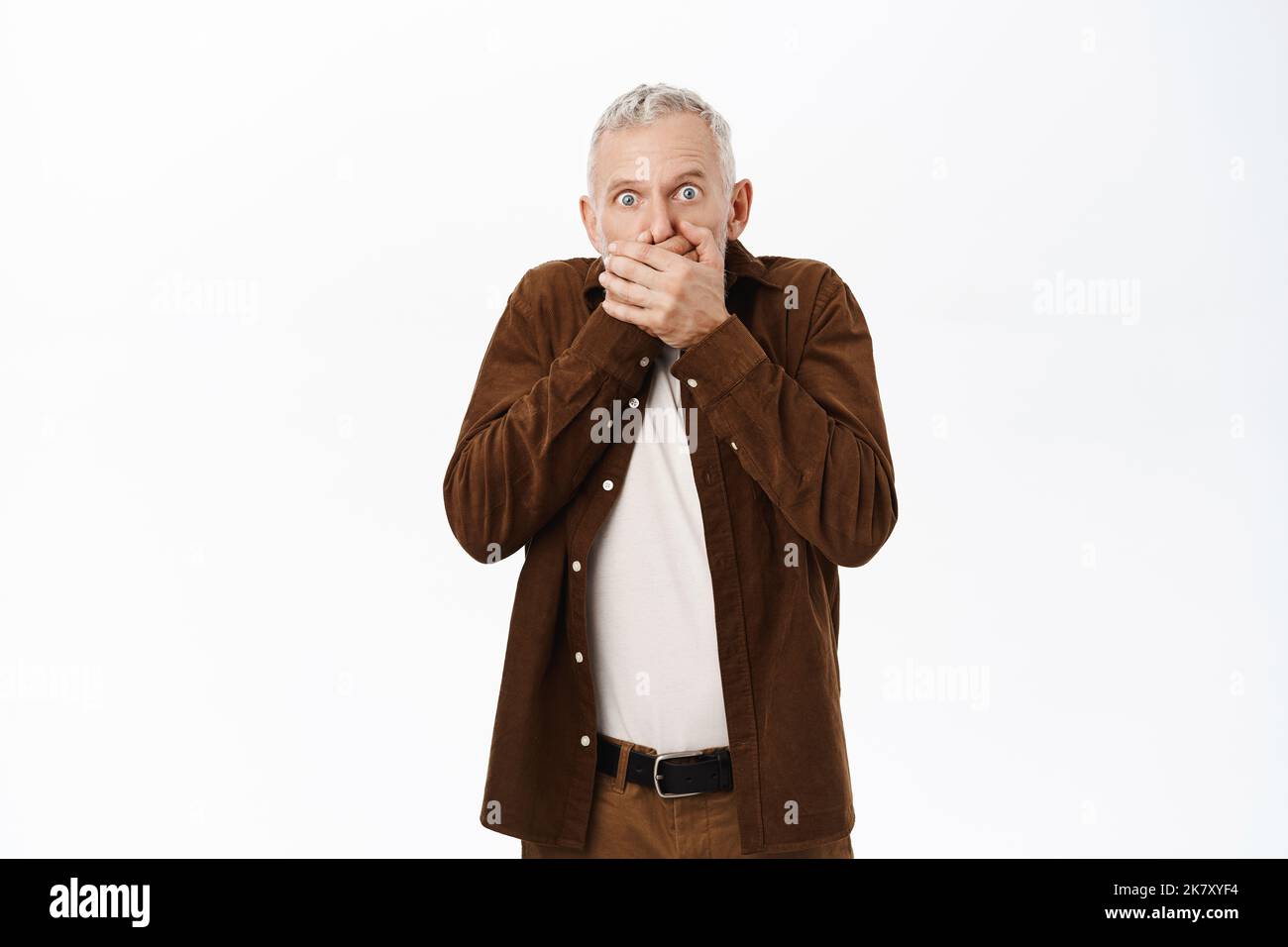 Shocked mature man, old male model looking speechless and stunned at ...