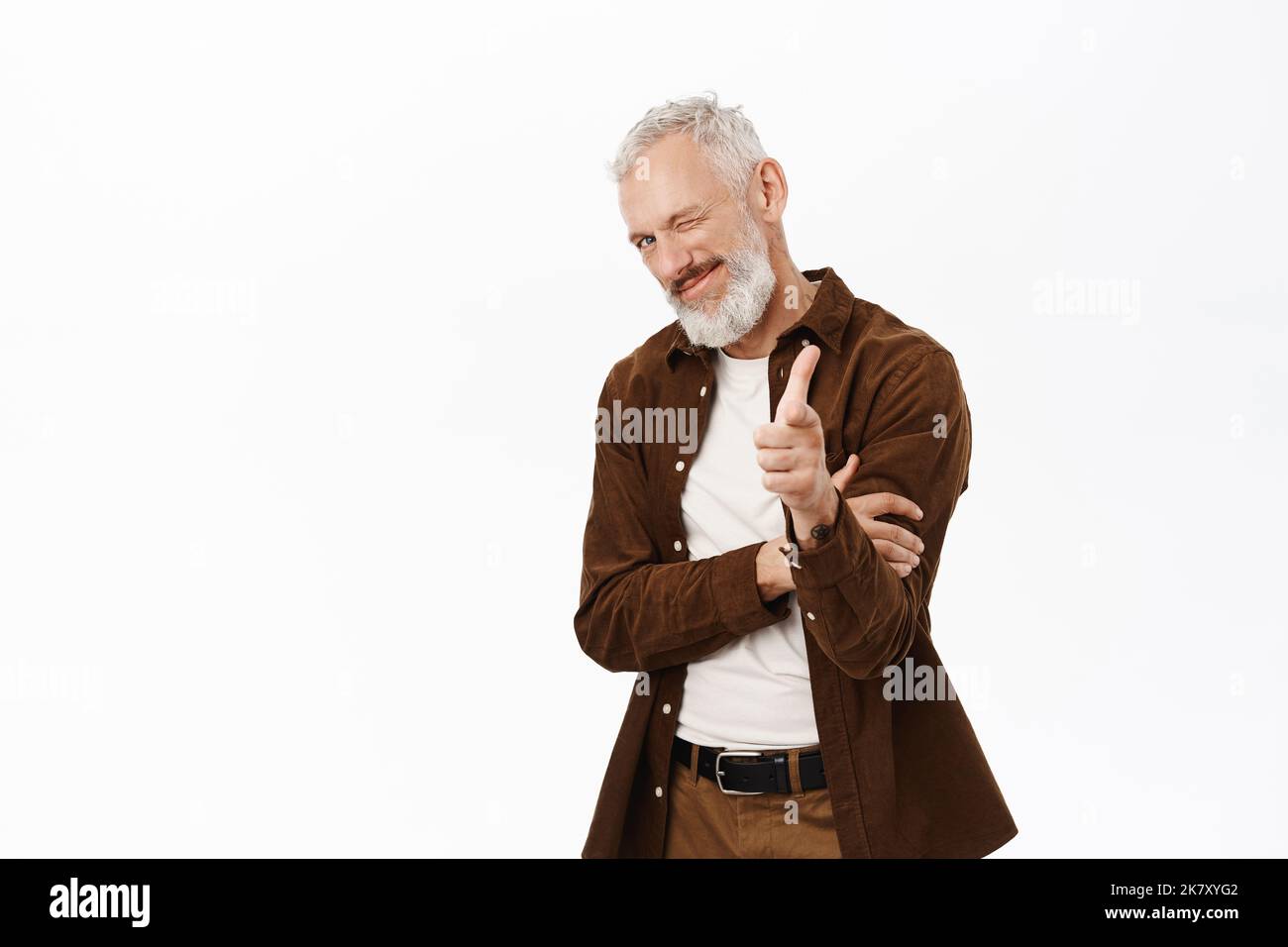 Mature winking man pointing hi-res stock photography and images - Alamy