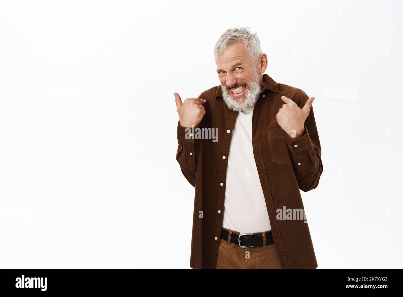 Modest senior guy, man with grey hair pointing fingers at himself with ...