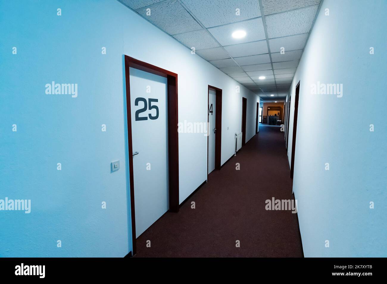 The number on the door in an unrecognizable hotel or hostel. Modern and ...