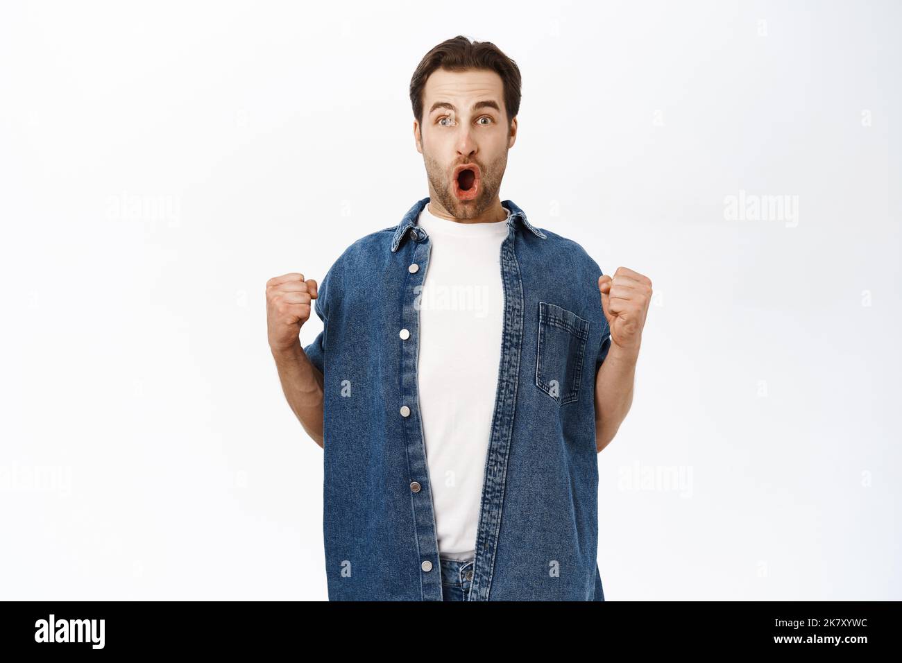 Image of enthusiastic adult man winning and celebrating victory ...