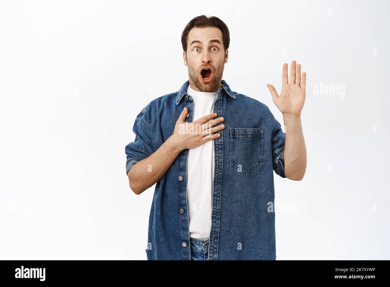 Excited smiling man introduce himself, raising one hand, standing in ...